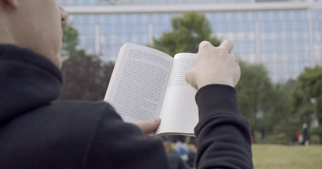 Reading a book in the park - Free Stock Video Footage | Coverr