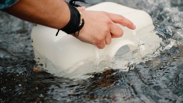 Filling up a water bottle - Free Stock Video Footage | Coverr