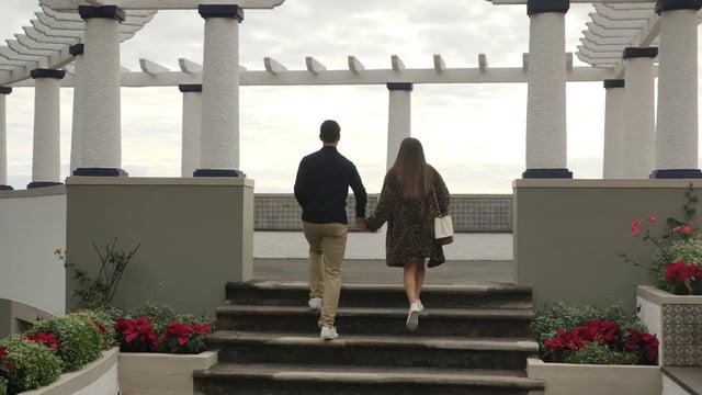 Couple walking up steps together - Free Stock Video Footage | Coverr