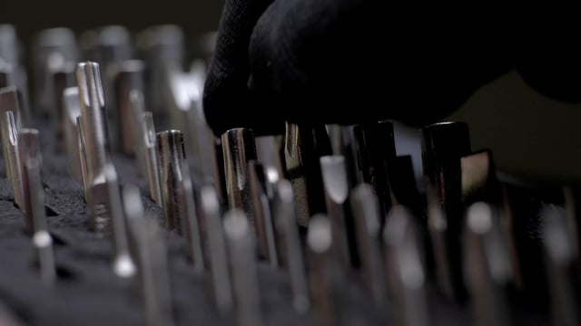 Picking up a bit from a toolbox - Free Stock Video Footage | Coverr