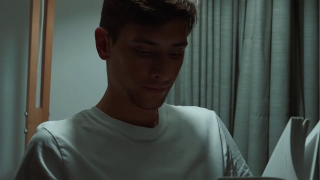 A man scanning through the pages of a book - Free Stock Video Footage ...